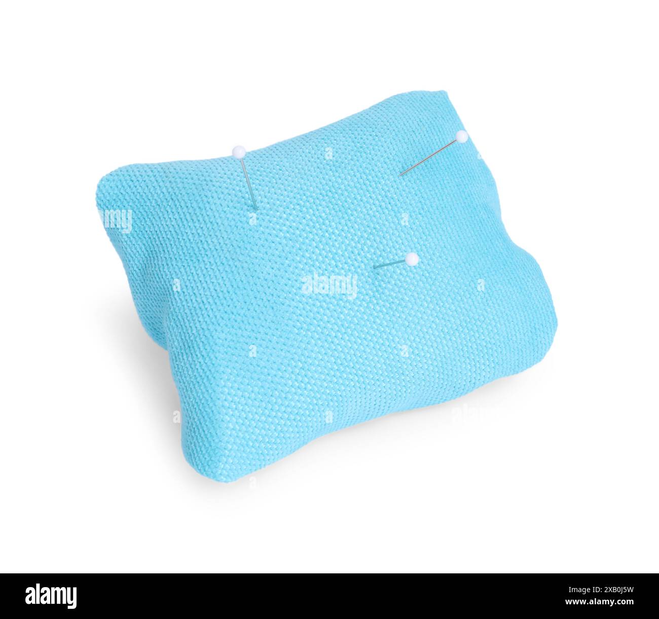 Light blue pincushion with sewing pins isolated on white Stock Photo ...