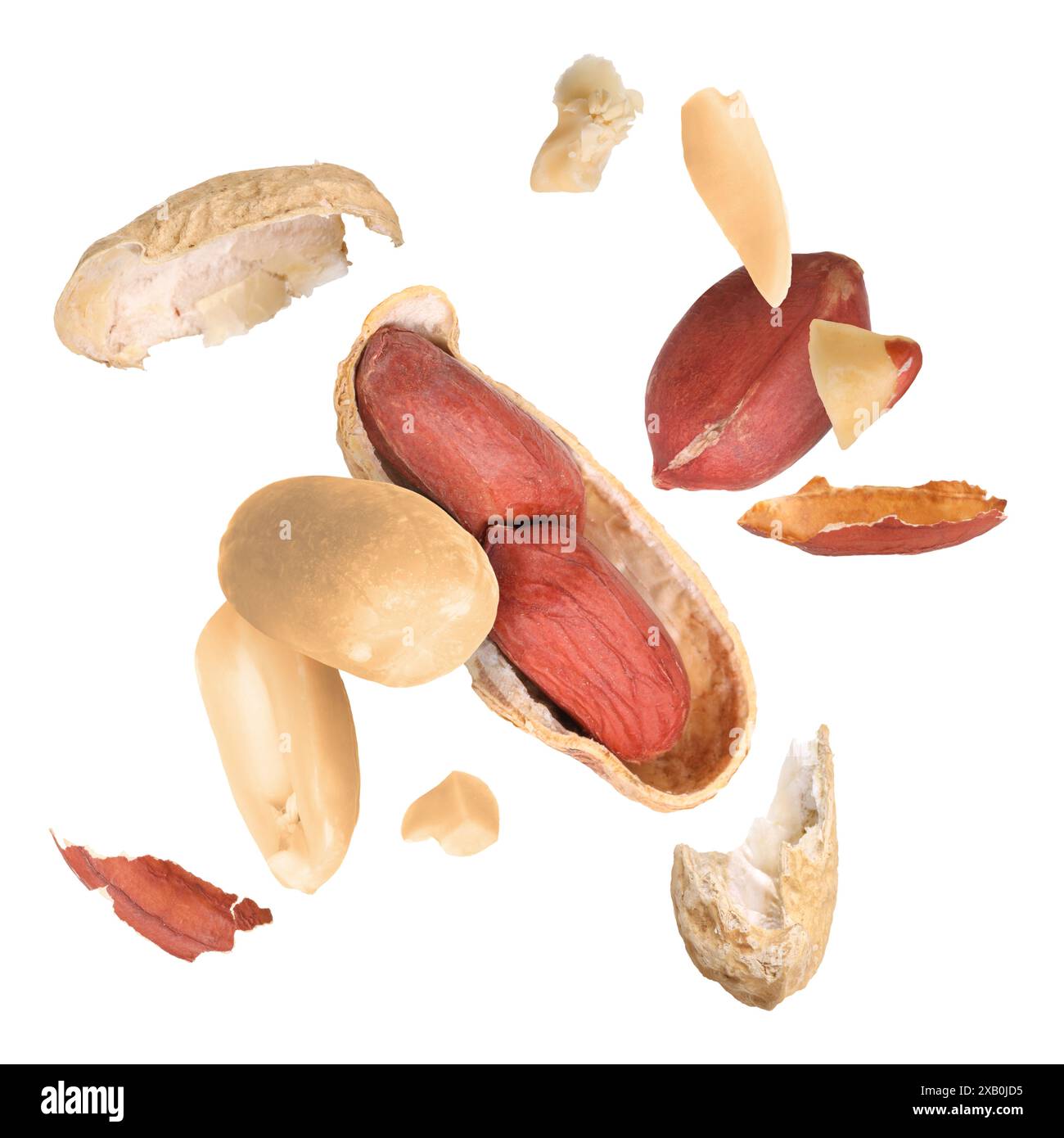 Peanuts and crushed pod in air on white background Stock Photo - Alamy