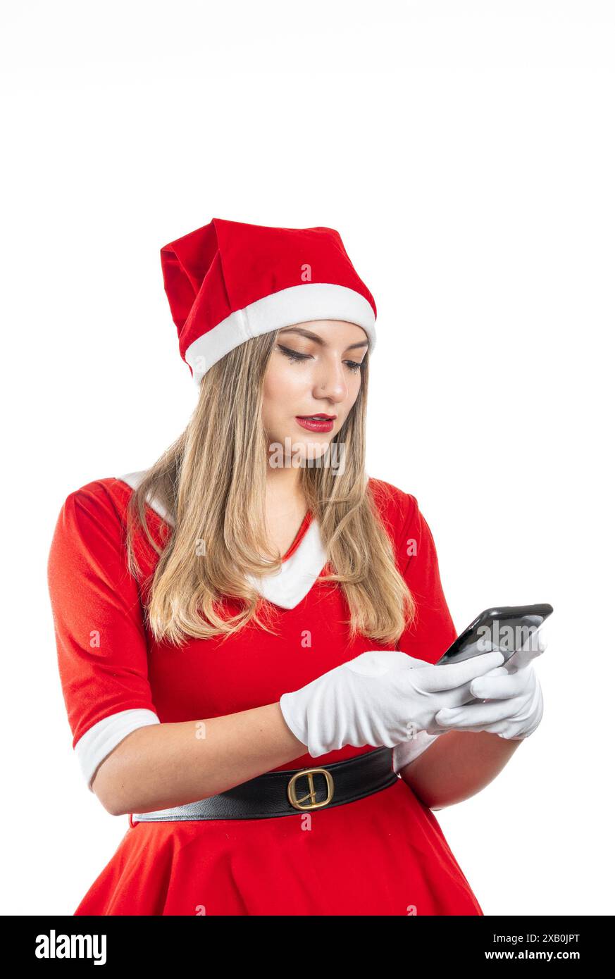Young woman dressed as Santa Claus sending a text message on a smart ...