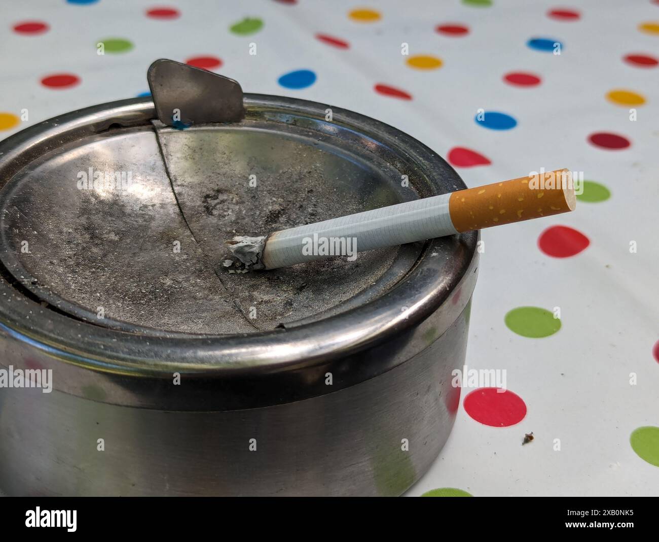 Cigarette in ashtray Stock Photo - Alamy