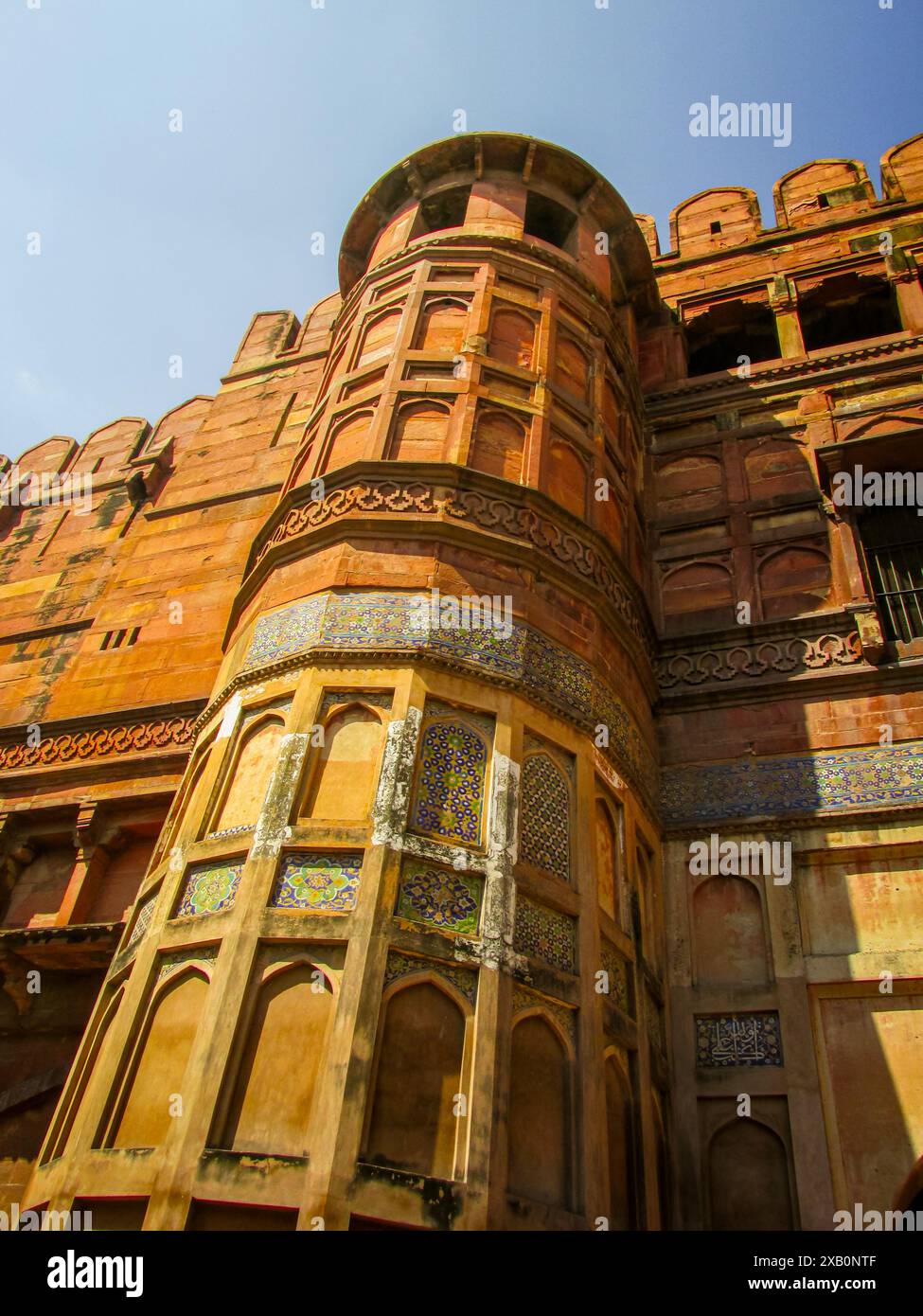 Agra, India - 29 October 2013: A close-up view of a red sandstone tower ...