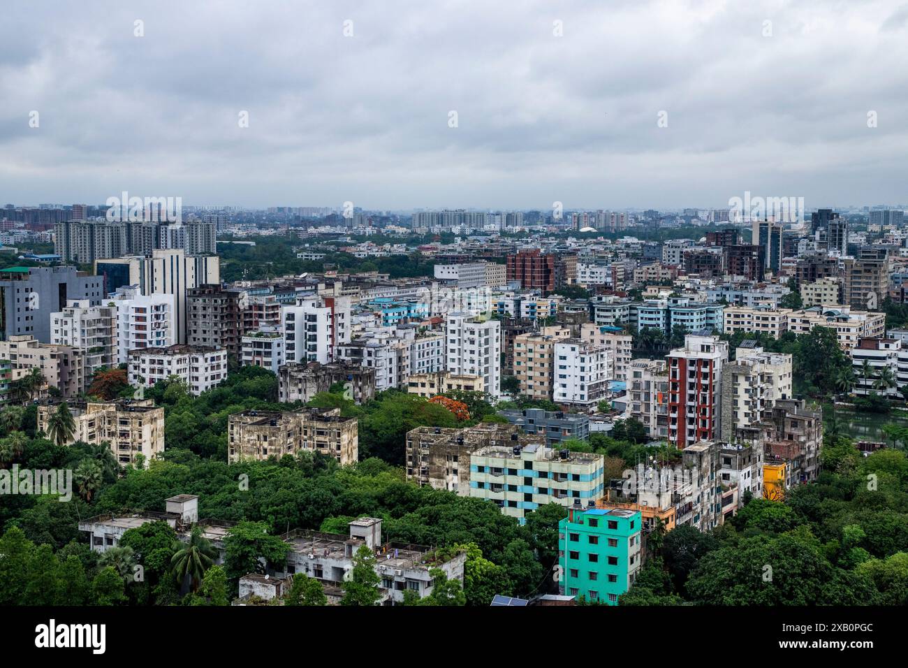 Aerial view of densely populated Dhaka city under a cloudy sky ...