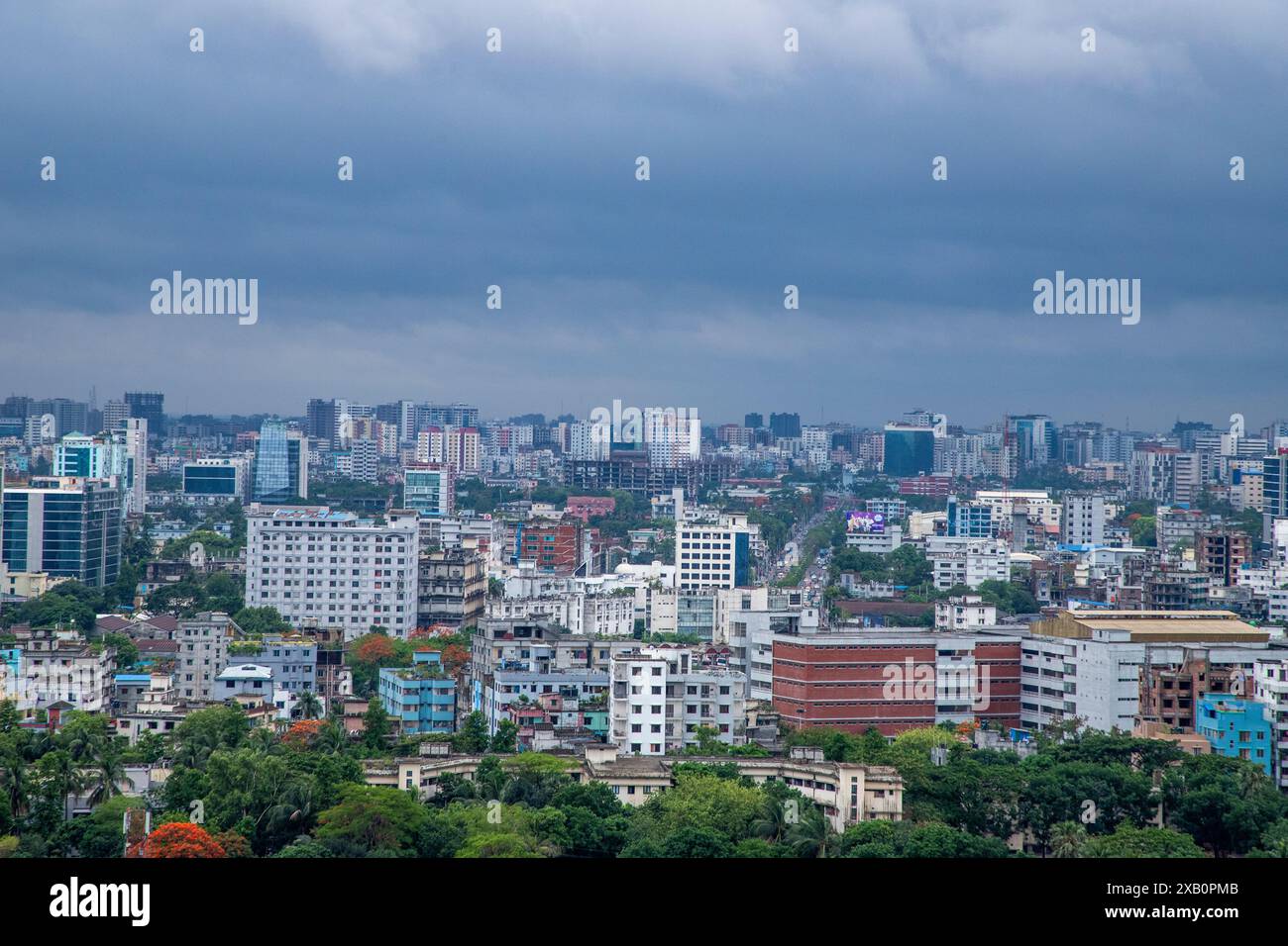 Aerial view of densely populated Dhaka city under a cloudy sky ...