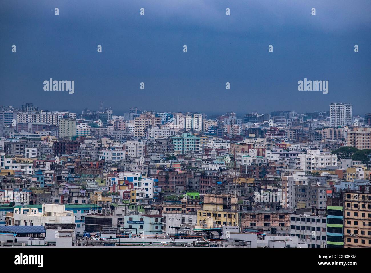 Aerial view of densely populated Dhaka city under a cloudy sky ...
