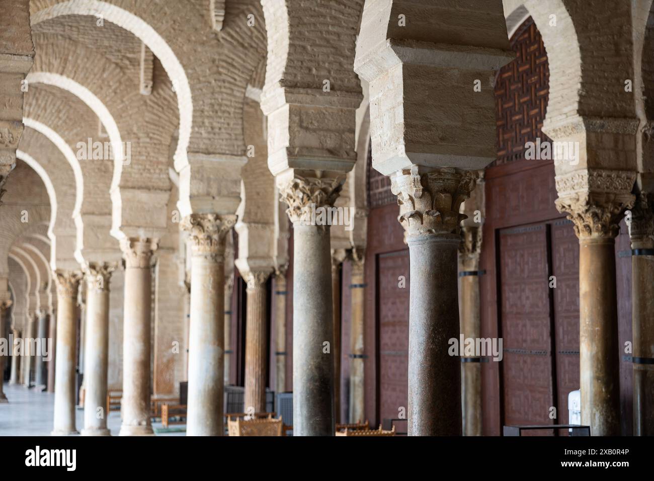 Riwaq with arches and columns around courtyard of Great Mosque of ...