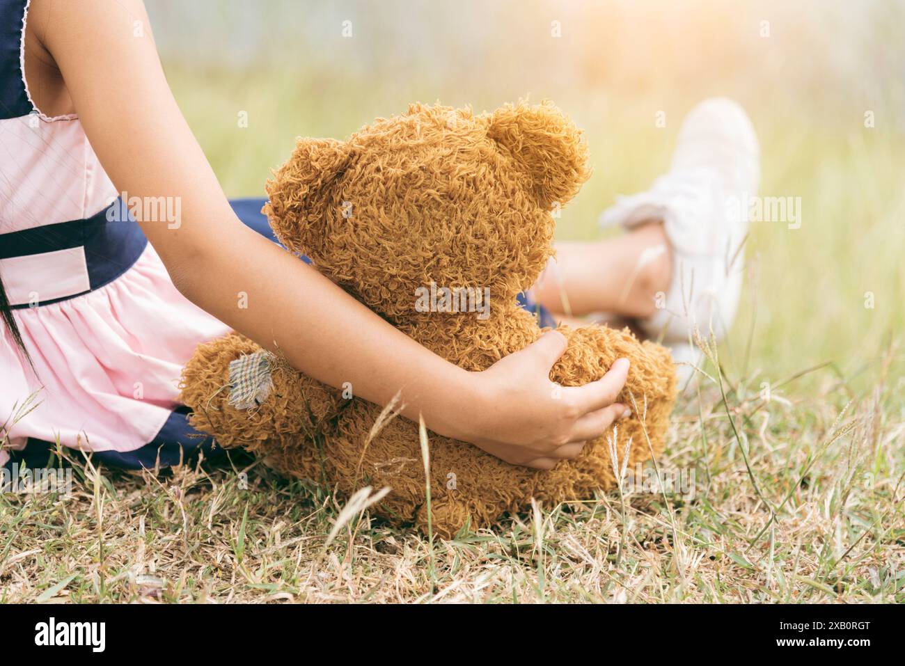 Happy Child hug teddy bear in green park playground. Teddy bear best ...