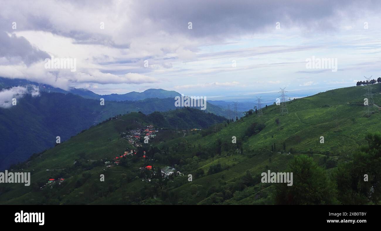 panoramic view of cloudy and foggy lush green himalaya mountains ...