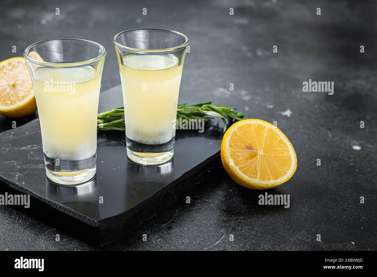 Traditional italian lemon alcohol drink liqueur limoncello with lemon ...