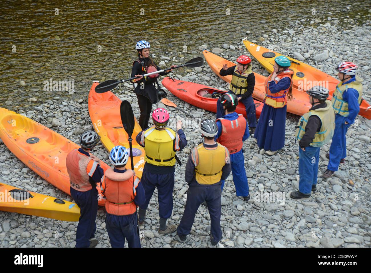 HAUPIRI, NEW ZEALAND, MAY 19, 2024: A kayaking instructor demonstrates ...