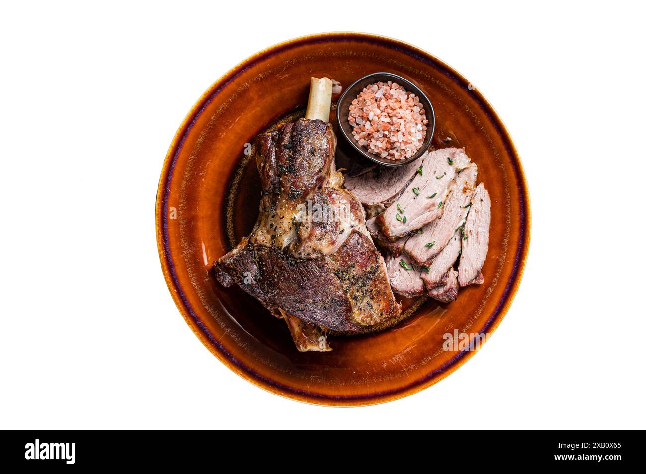 BBQ Roast Lamb mutton leg sliced on a rustic plate. Isolated on white ...