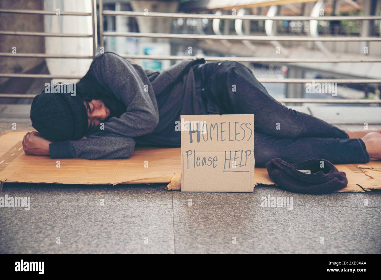 Homeless person receiving help hi-res stock photography and images - Alamy