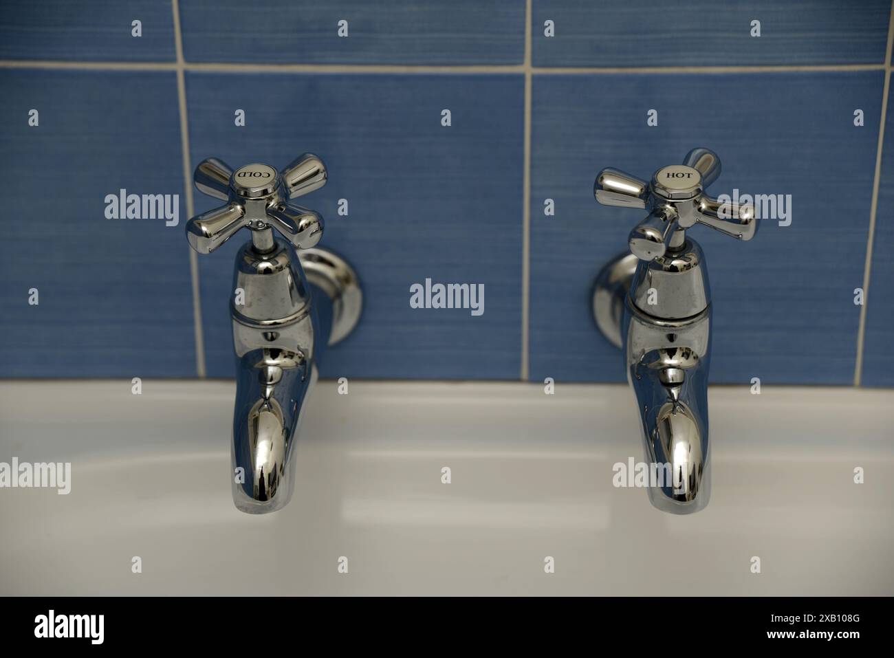 detail of water taps in a retro bathroom Stock Photo - Alamy