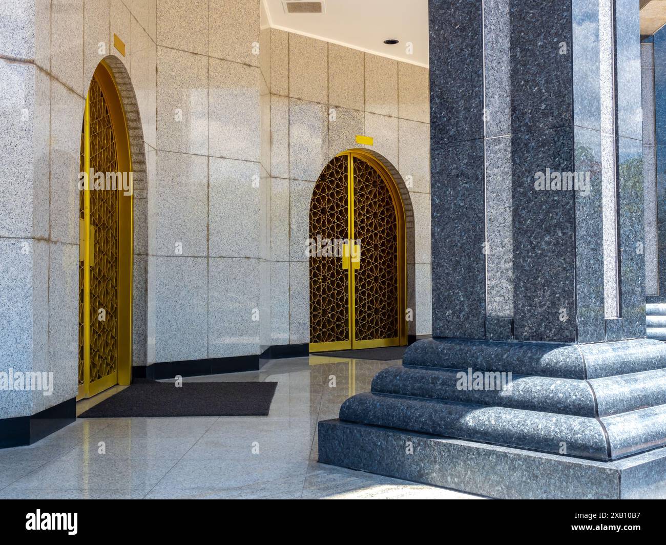 Beautiful pattern on curved wooden door with gold handle, decoration of ...
