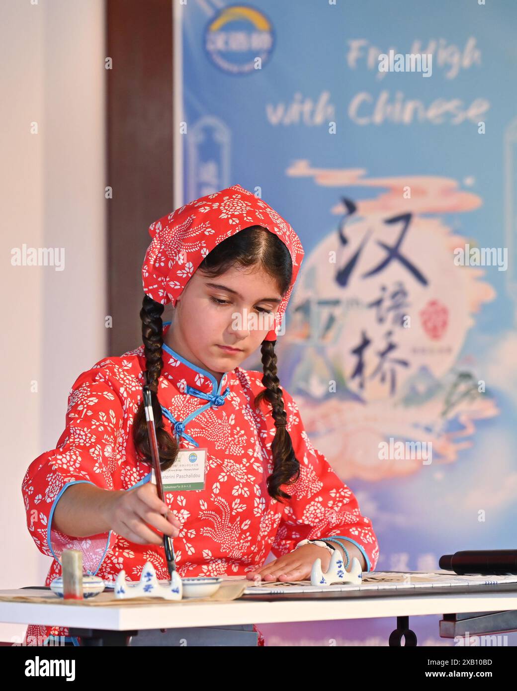 Hamburg, Germany. 8th June, 2024. A contestant performs calligraphy ...