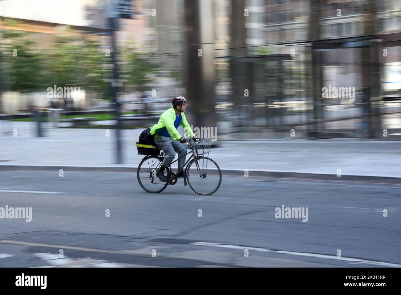 Delivery man riding bicycle hi-res stock photography and images - Alamy