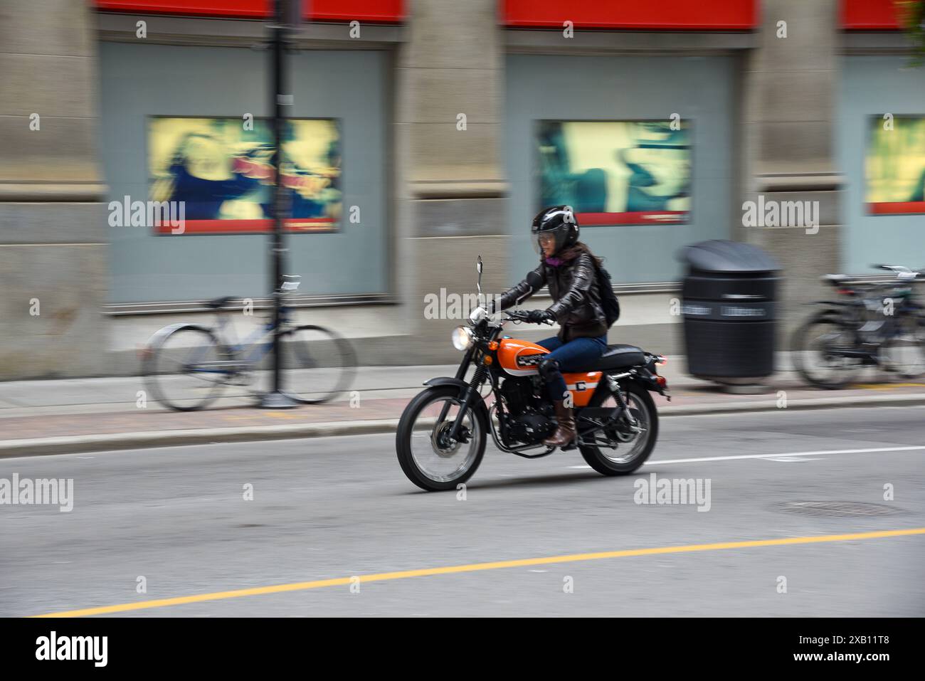 Woman riding motorcycle hi-res stock photography and images - Alamy