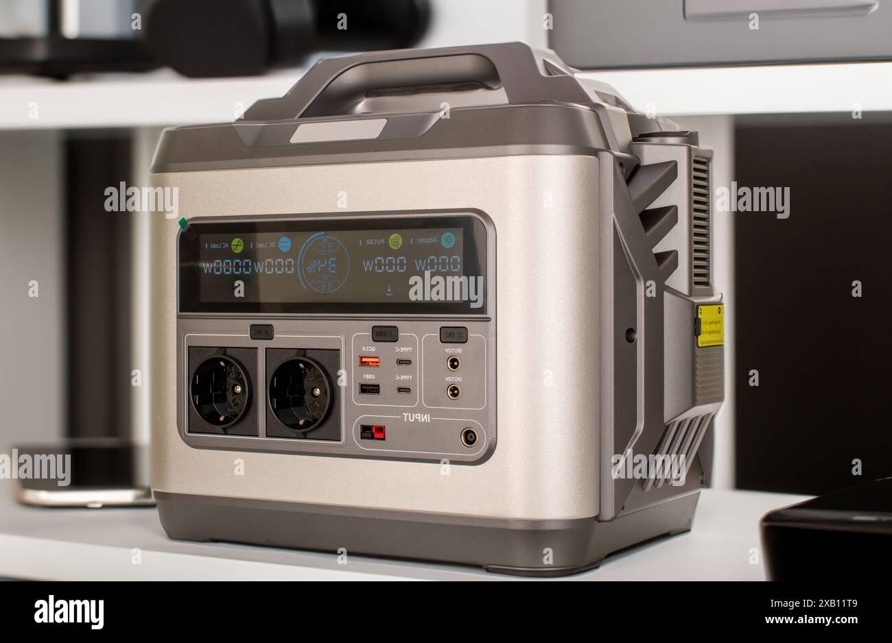 One universal electric battery, a portable charging station stands on a ...