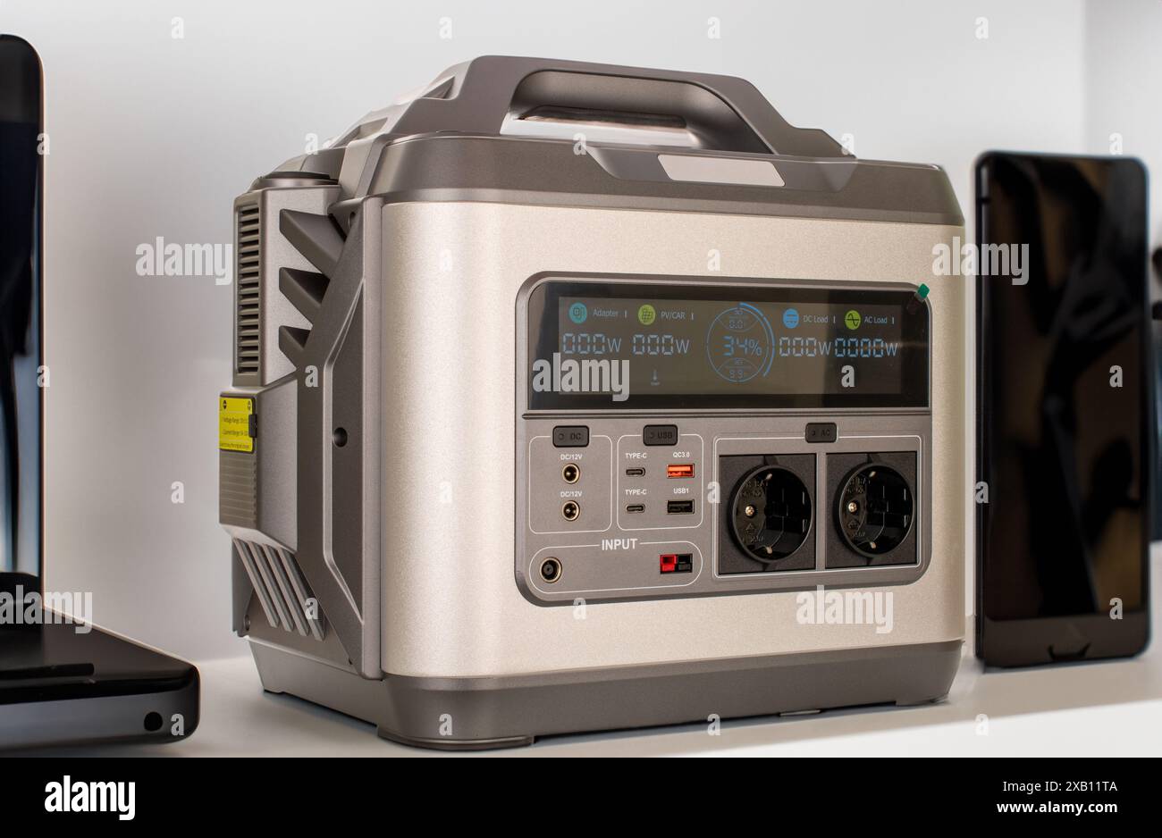 One universal electric battery, a portable charging station stands on a ...