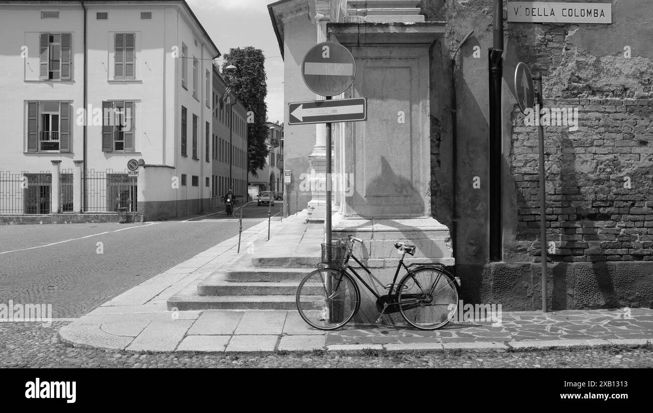 Leaning against a pole Black and White Stock Photos & Images - Alamy