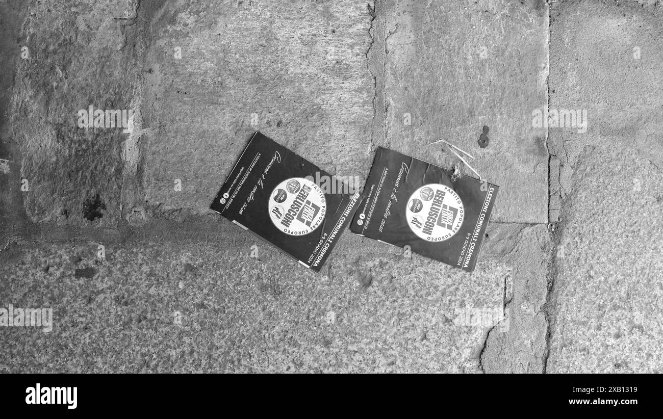 Cremona, Italy - May 16th 2024 Two discarded political flyers ...