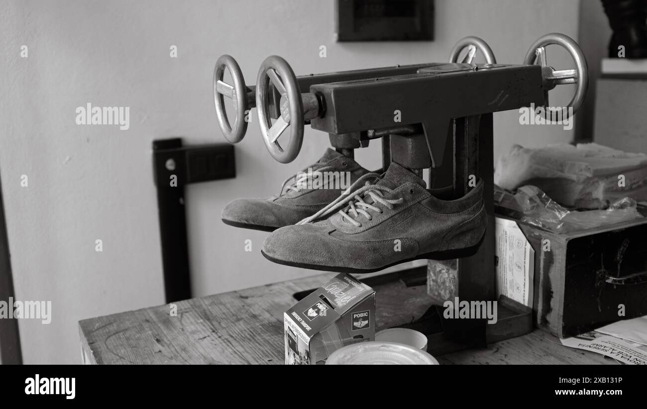 Cremona, Italy - May 16th 2024 Stretching suede shoes on a machine in a ...