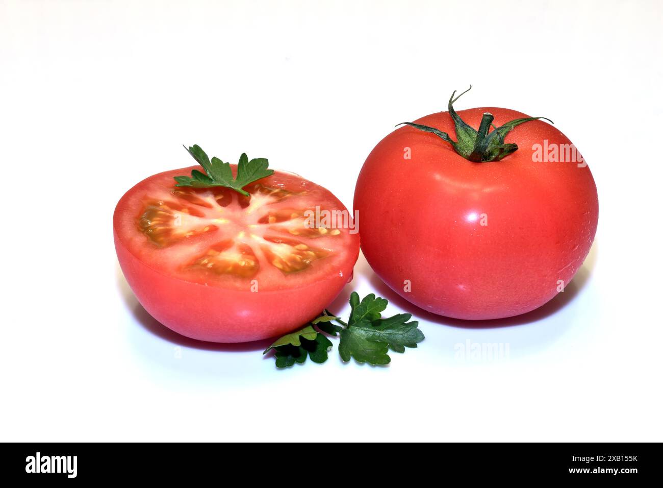 Two half cut tomato tomatoes hi-res stock photography and images - Alamy