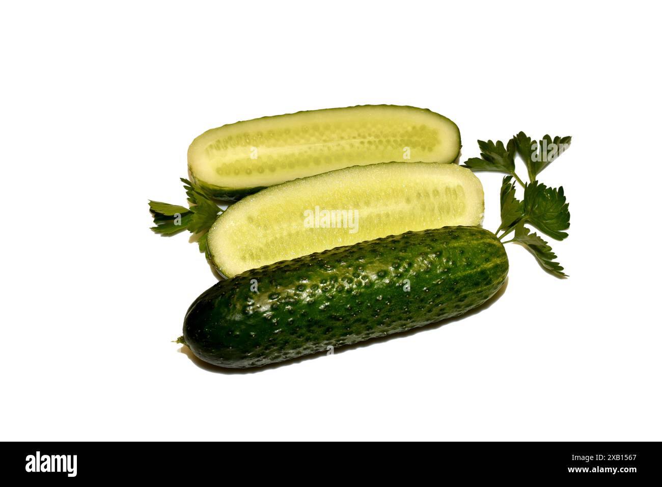 Two ripe cucumbers, one whole and the other cut in half Stock Photo - Alamy