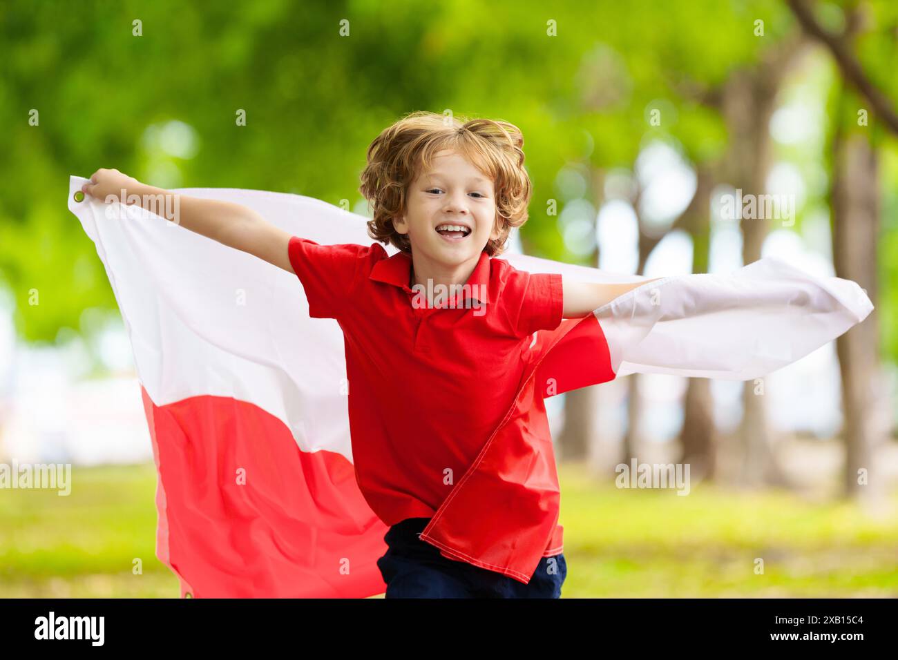 Child running with Poland flag. Little Polish boy cheering for football ...