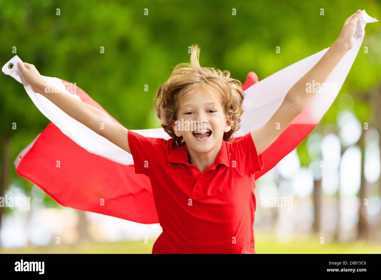 Child running with Poland flag. Little Polish boy cheering for football ...