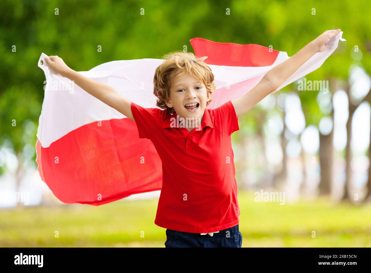 Child running with Poland flag. Little Polish boy cheering for football ...