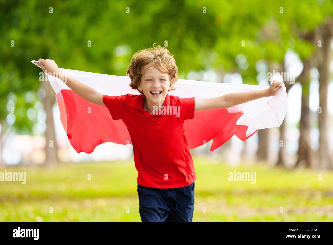 Child running with Poland flag. Little Polish boy cheering for football ...