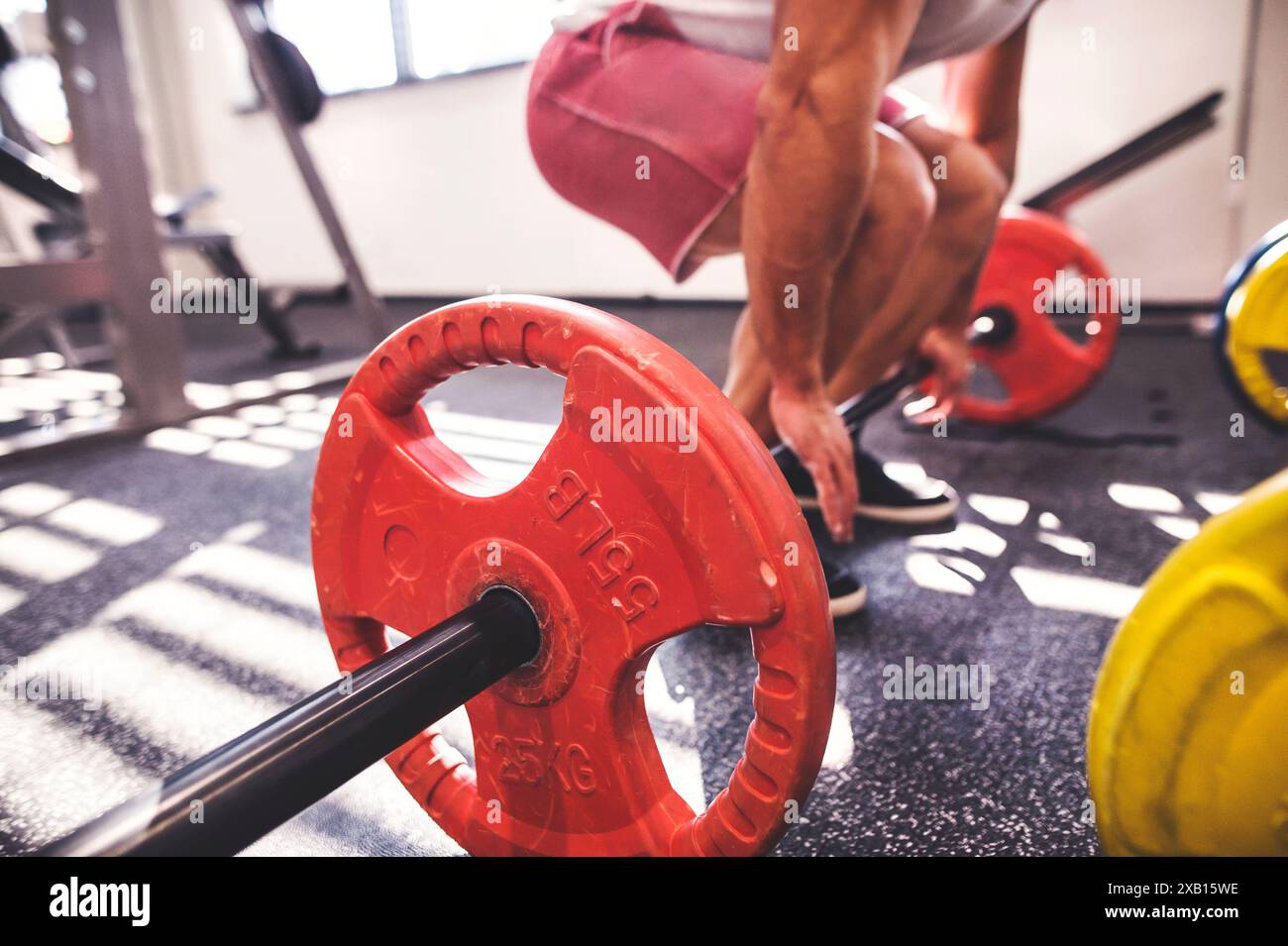 Strong man performing deadlift with barbell. Routine workout for ...