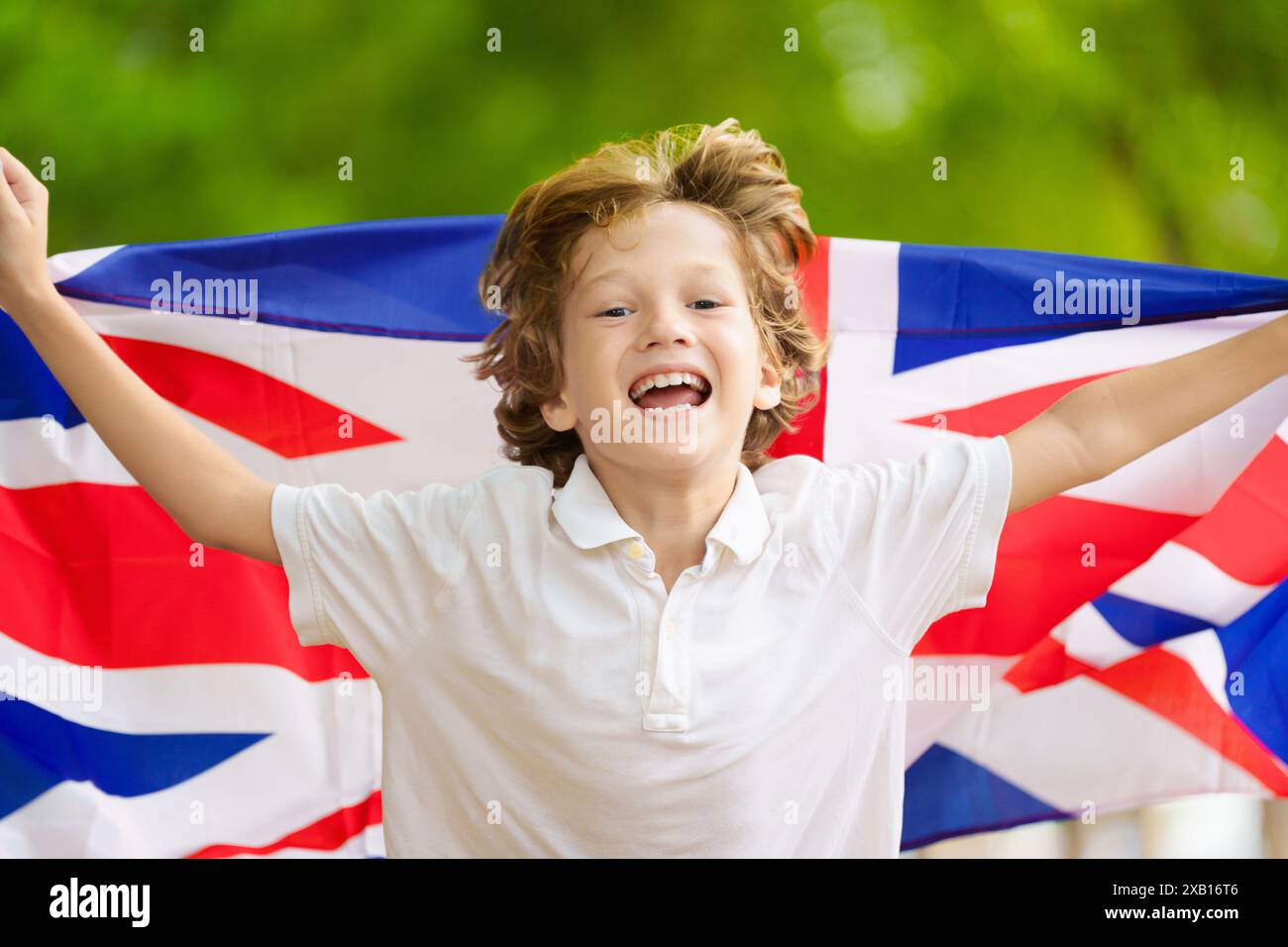 Child running with UK flag. British supporter. Little Britain fan kid ...