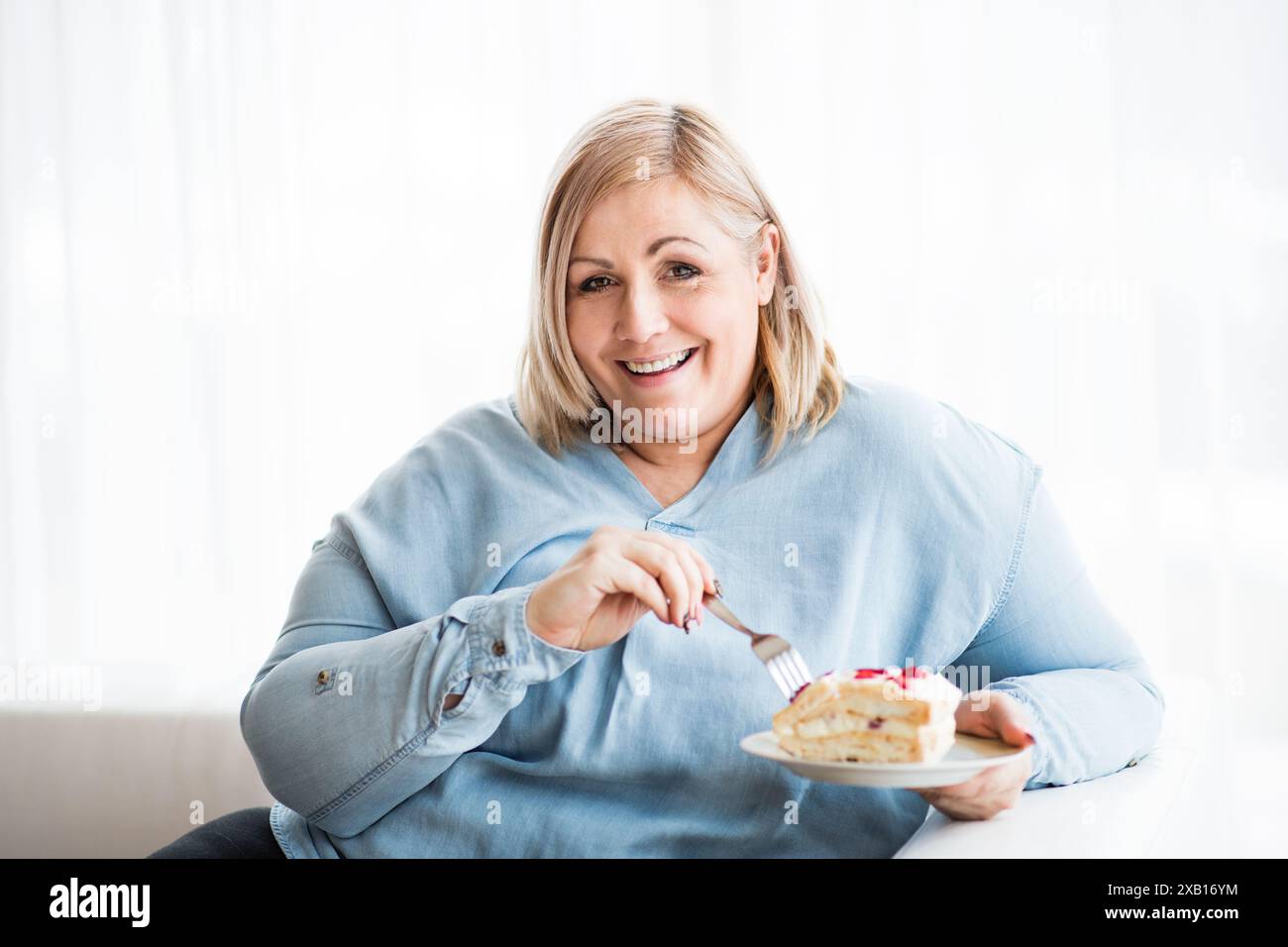 Fat woman eating slice cake hi-res stock photography and images - Alamy