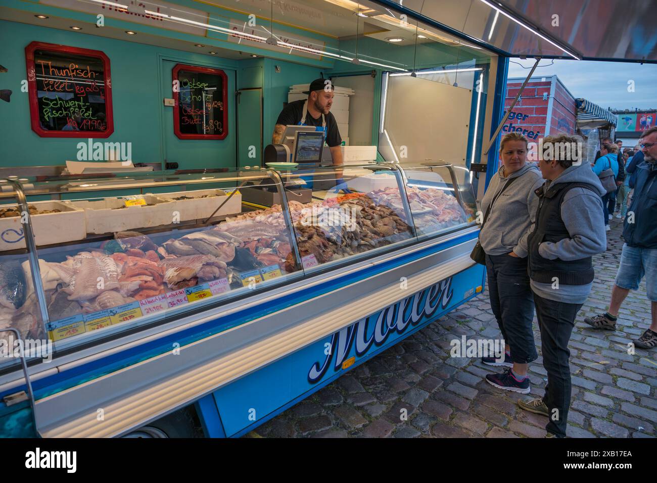 Hamburg, Germany - July 17, 2022: tourists buying fresh fish at shop in ...