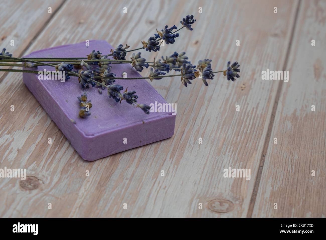 Lavender soap on wooden background with copy space for your text. Advertisement template mock up ...