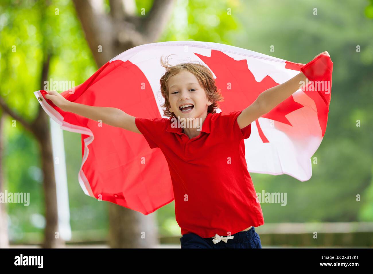 Child with Canadian flag. Happy Canada day. Little boy running with ...