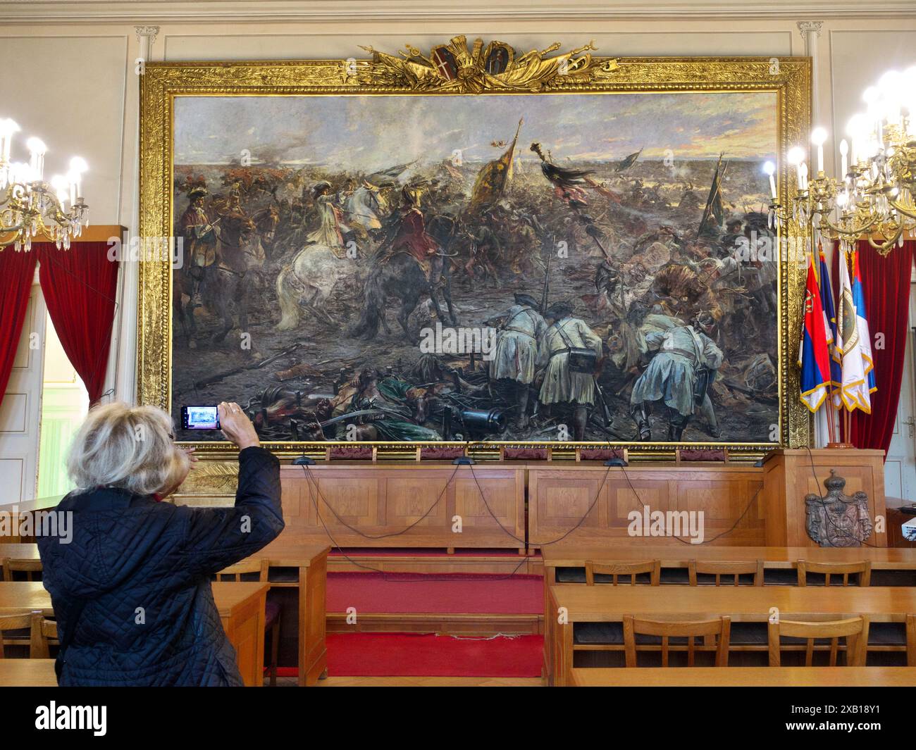 tourist take a picture of painting "Battle of Zenta" in County Hall of ...