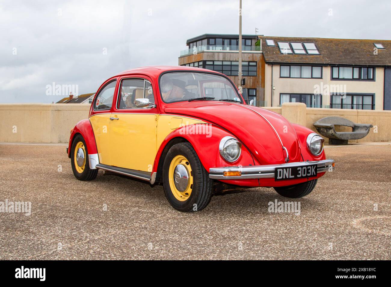 1972 70s seventies Red Yellow VW Volkswagen 1300 Beetle; parked on ...