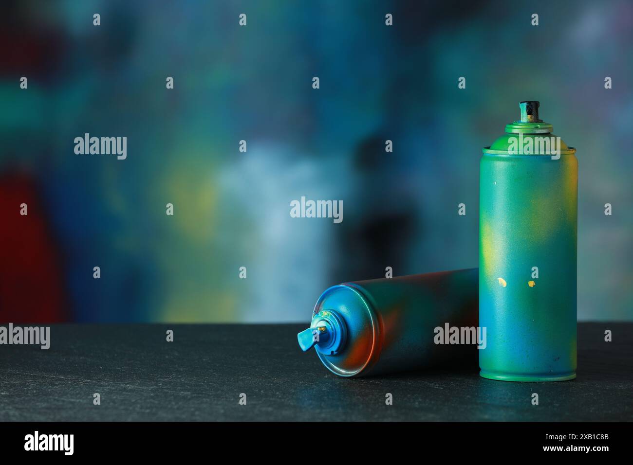Two graffiti color spray cans hi-res stock photography and images - Alamy