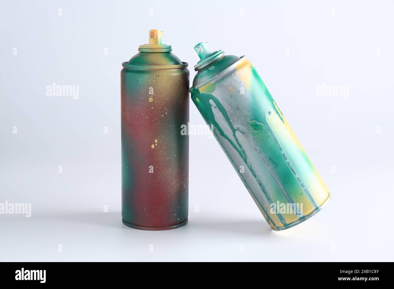 Two spray paint cans on white background Stock Photo - Alamy