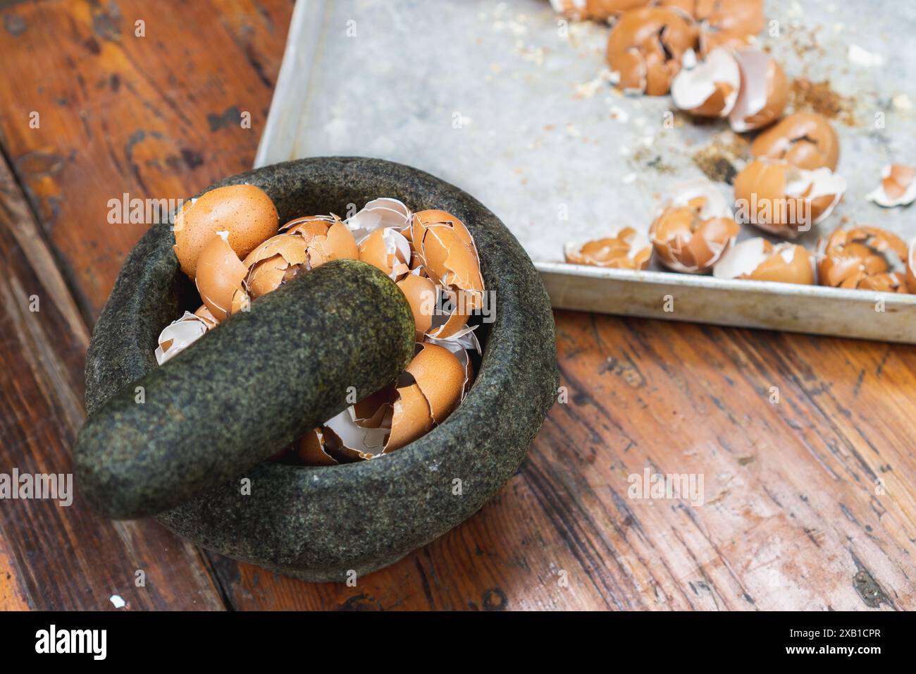 egg shell being crush with pestle and mortar Stock Photo - Alamy