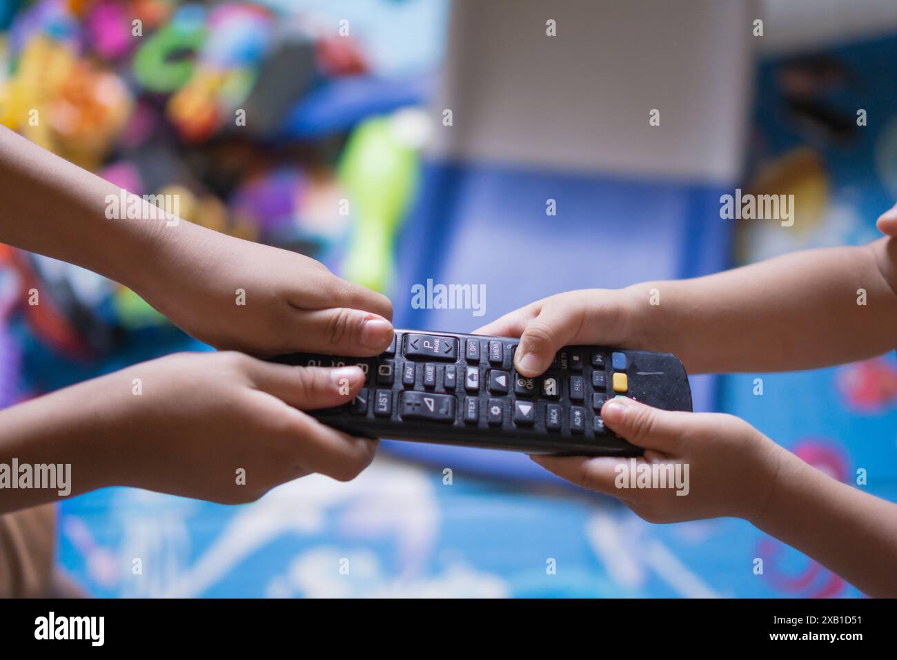 Brother sister fighting over control hi-res stock photography and ...