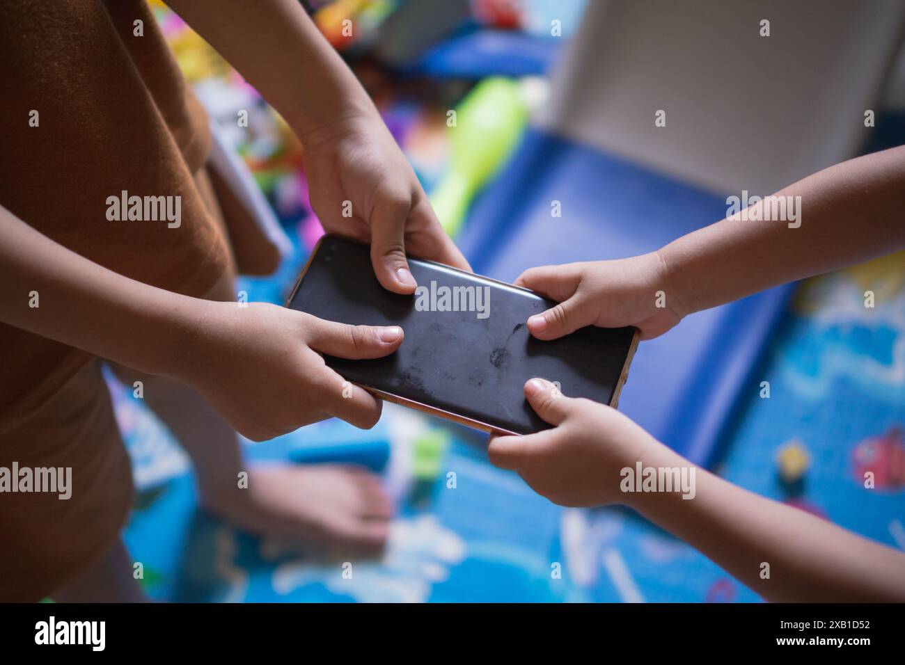 Brother sister fighting over control hi-res stock photography and ...