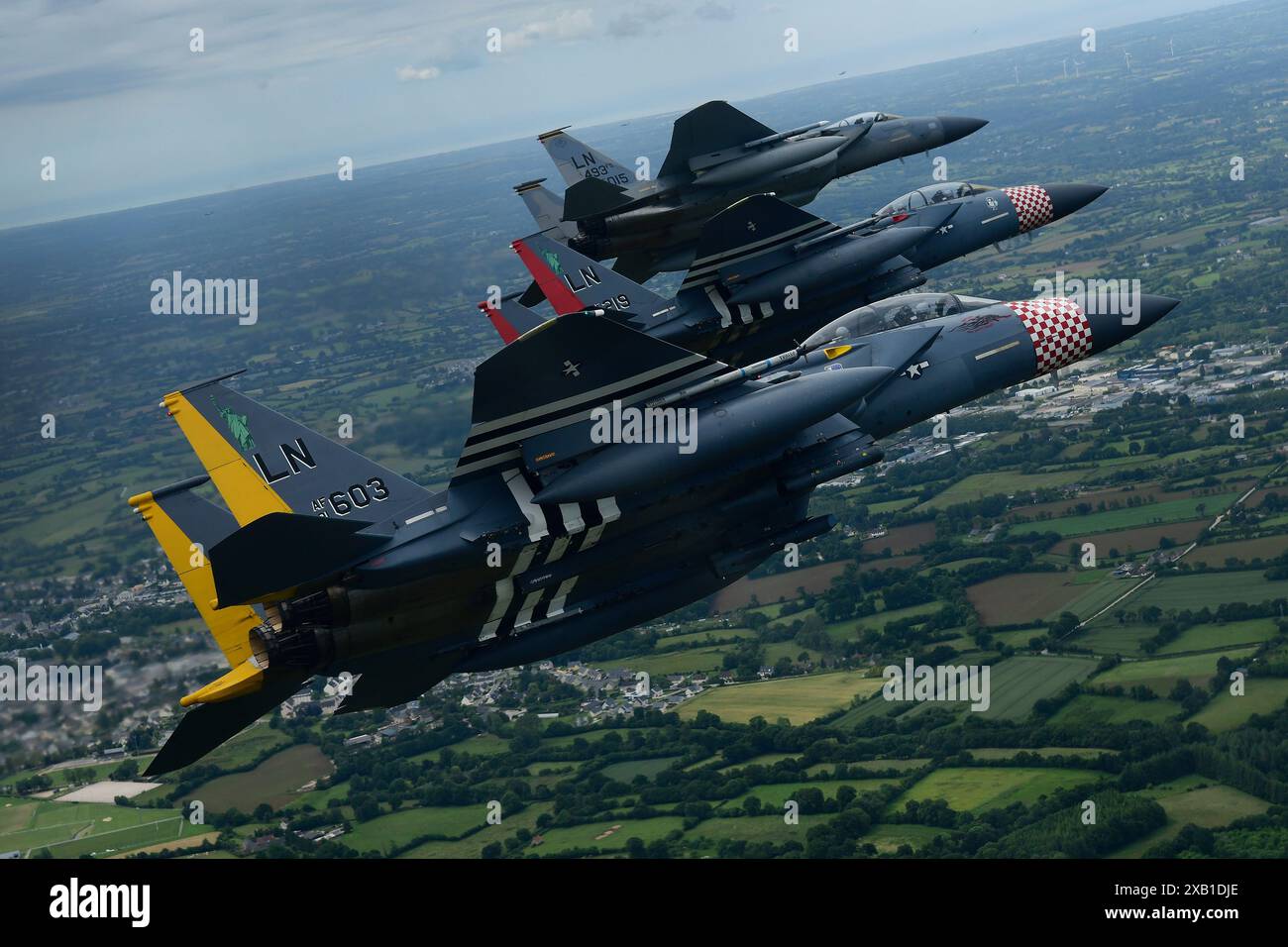 An F-15C Eagle and a pair of heritage painted F-15E Strike Eagles ...