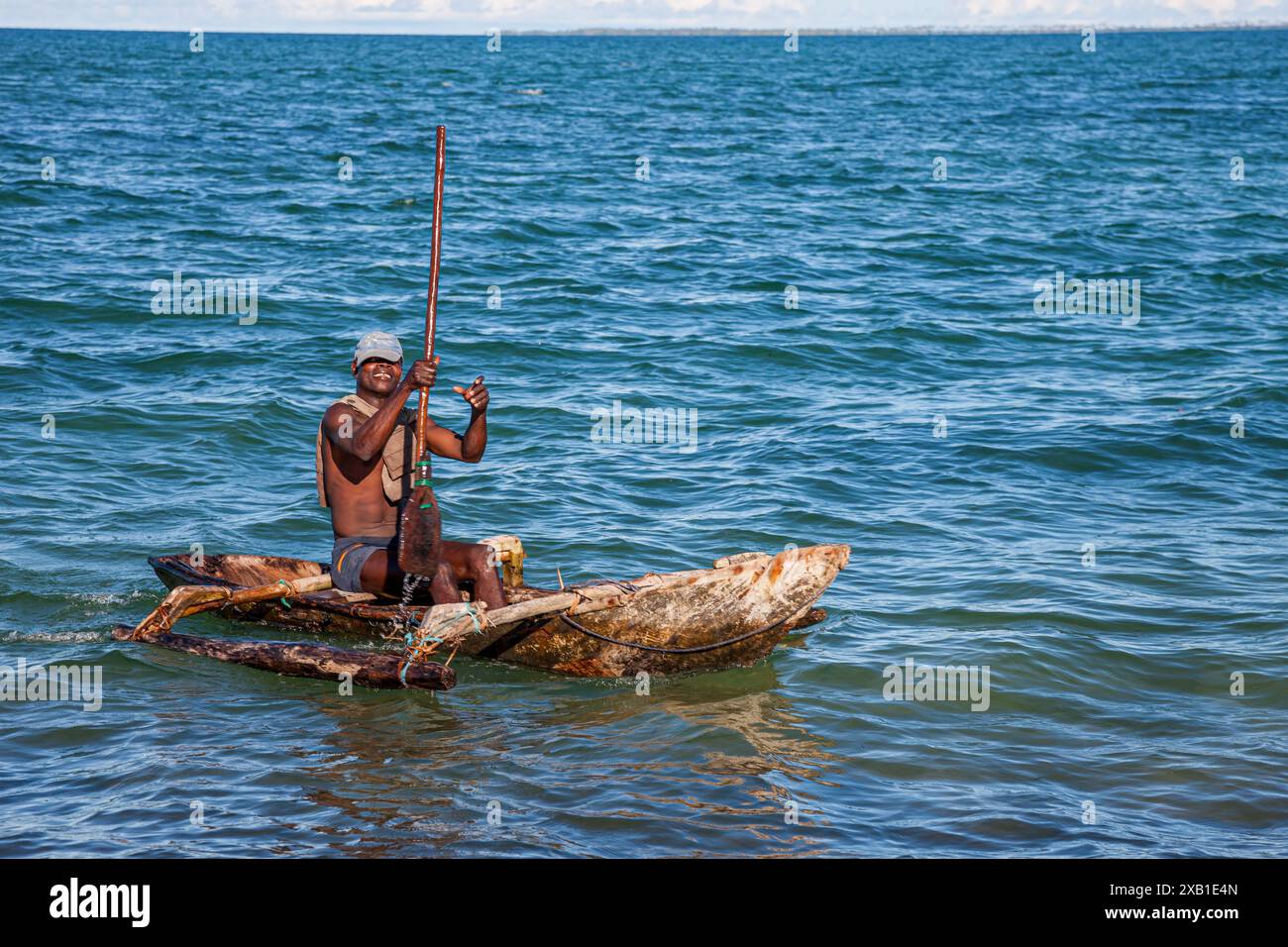 Mozambique, Cabo Delgado, Quirimbas, Guludo, Fisherman with poor boat ...