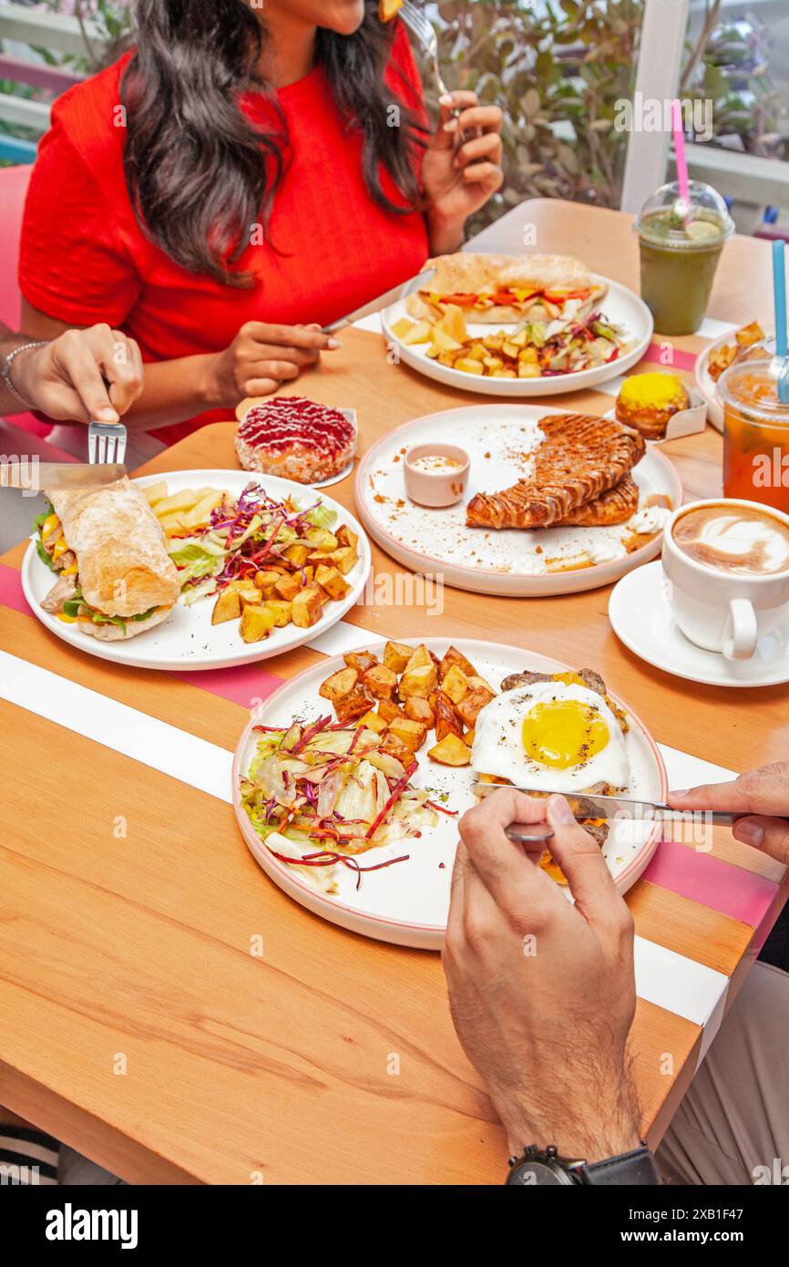 Brunch with friends feasting having a good time Stock Photo - Alamy