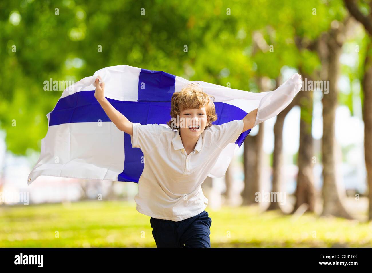 Child running with Finland flag. Little Finnish boy cheering for ...