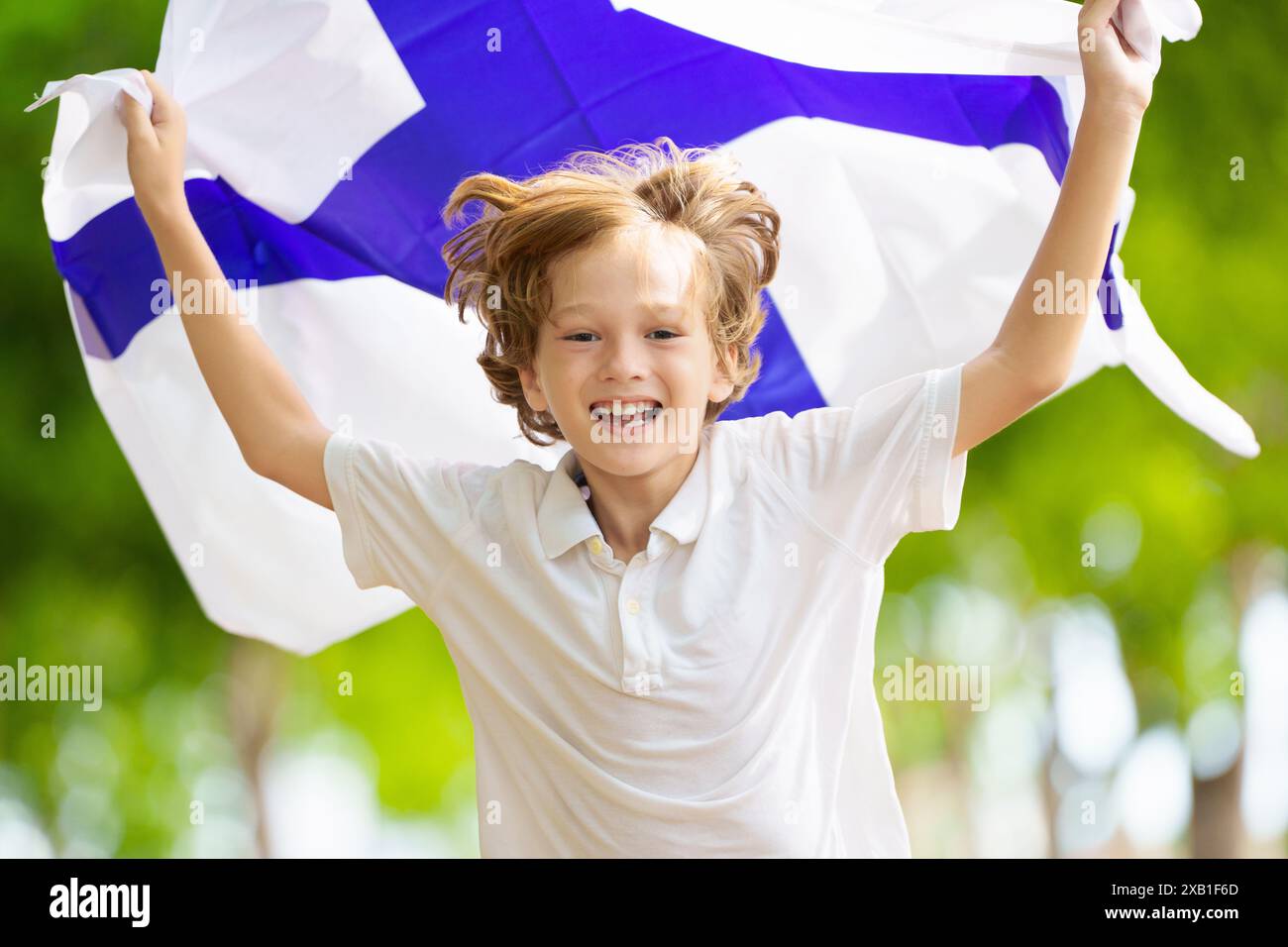 Child running with Finland flag. Little Finnish boy cheering for ...