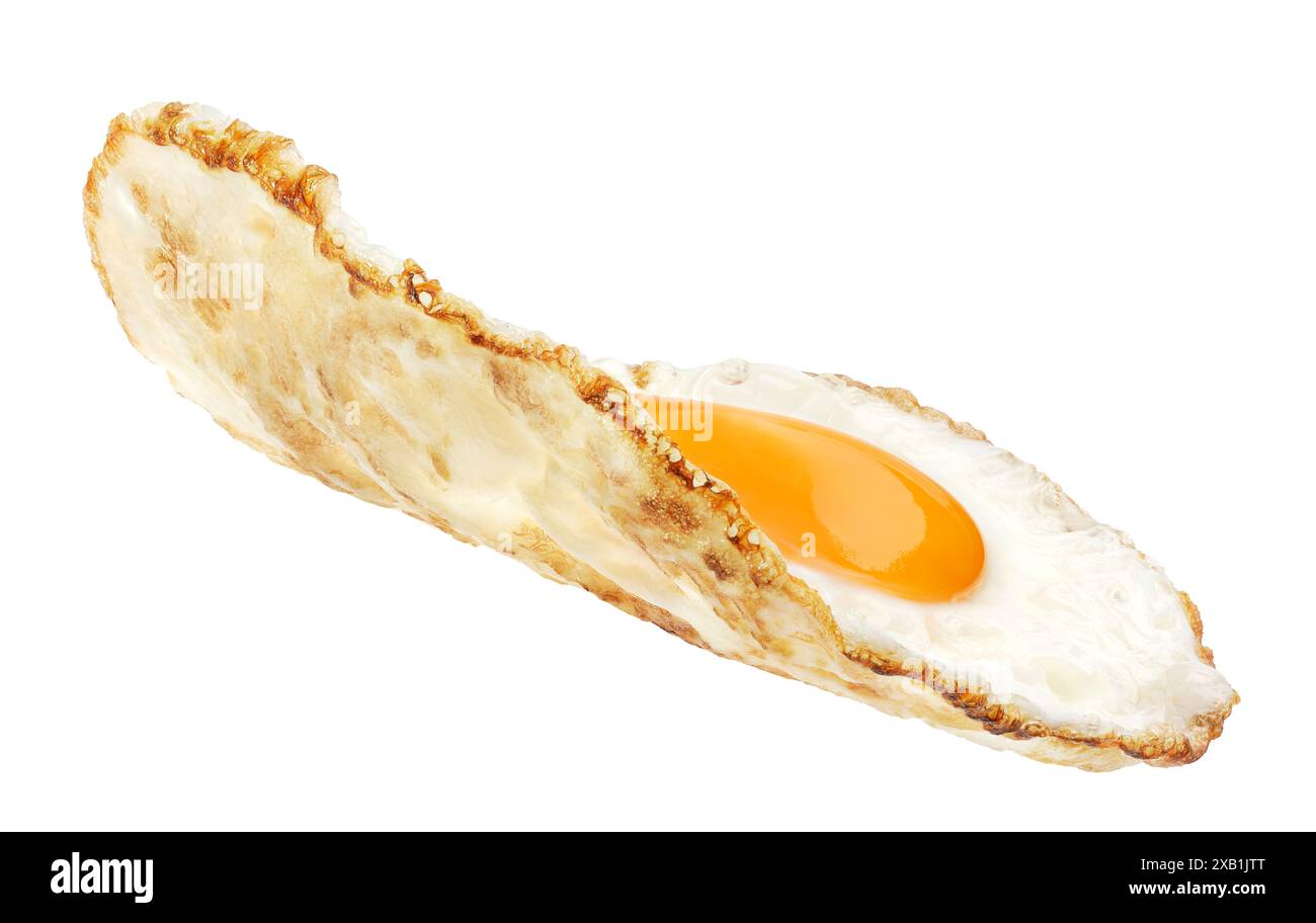 Flying fried egg isolated on white background Stock Photo - Alamy